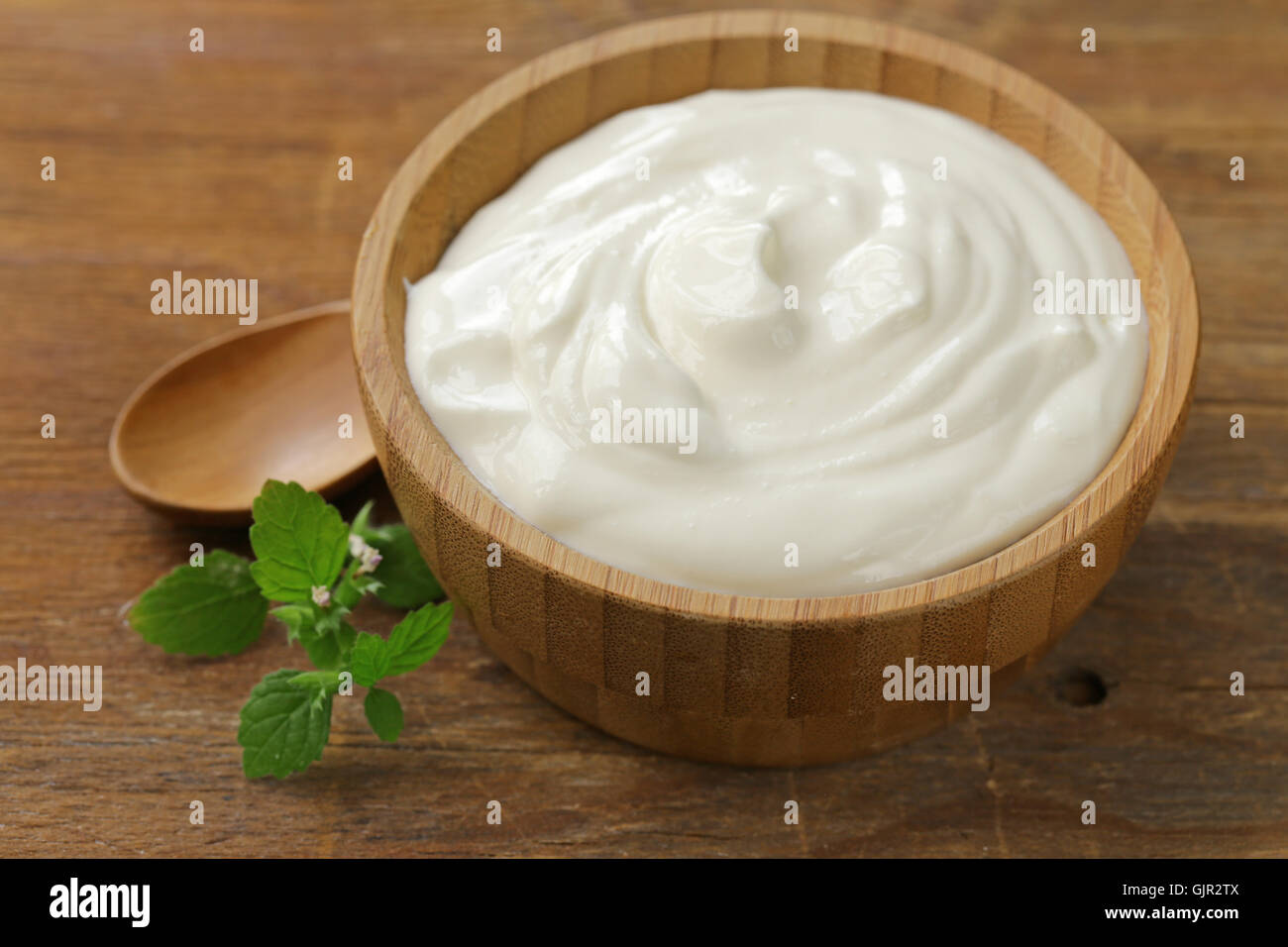 homemade organic sour cream in a wooden bowl Stock Photo - Alamy
