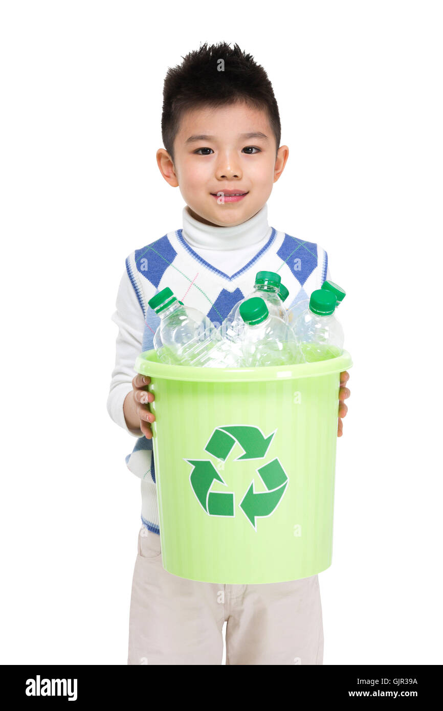 Studio shot boy holding trash Stock Photo - Alamy