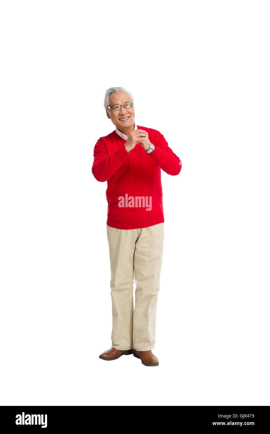 Studio shot of an old man Baoquan salute Stock Photo - Alamy