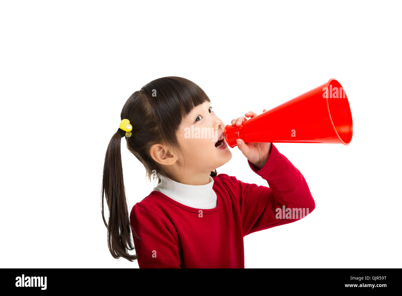 Studio shot little girl riding a pony trumpet Stock Photo - Alamy