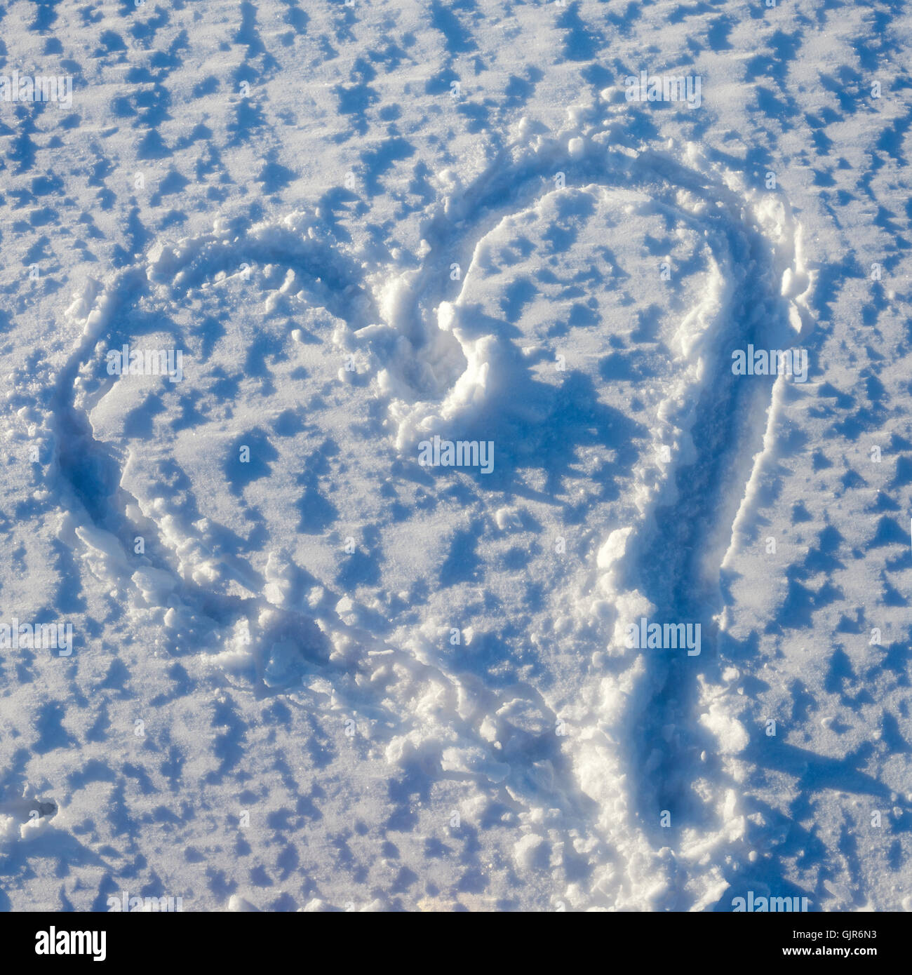 Snow Heart of Love Stock Photo - Alamy