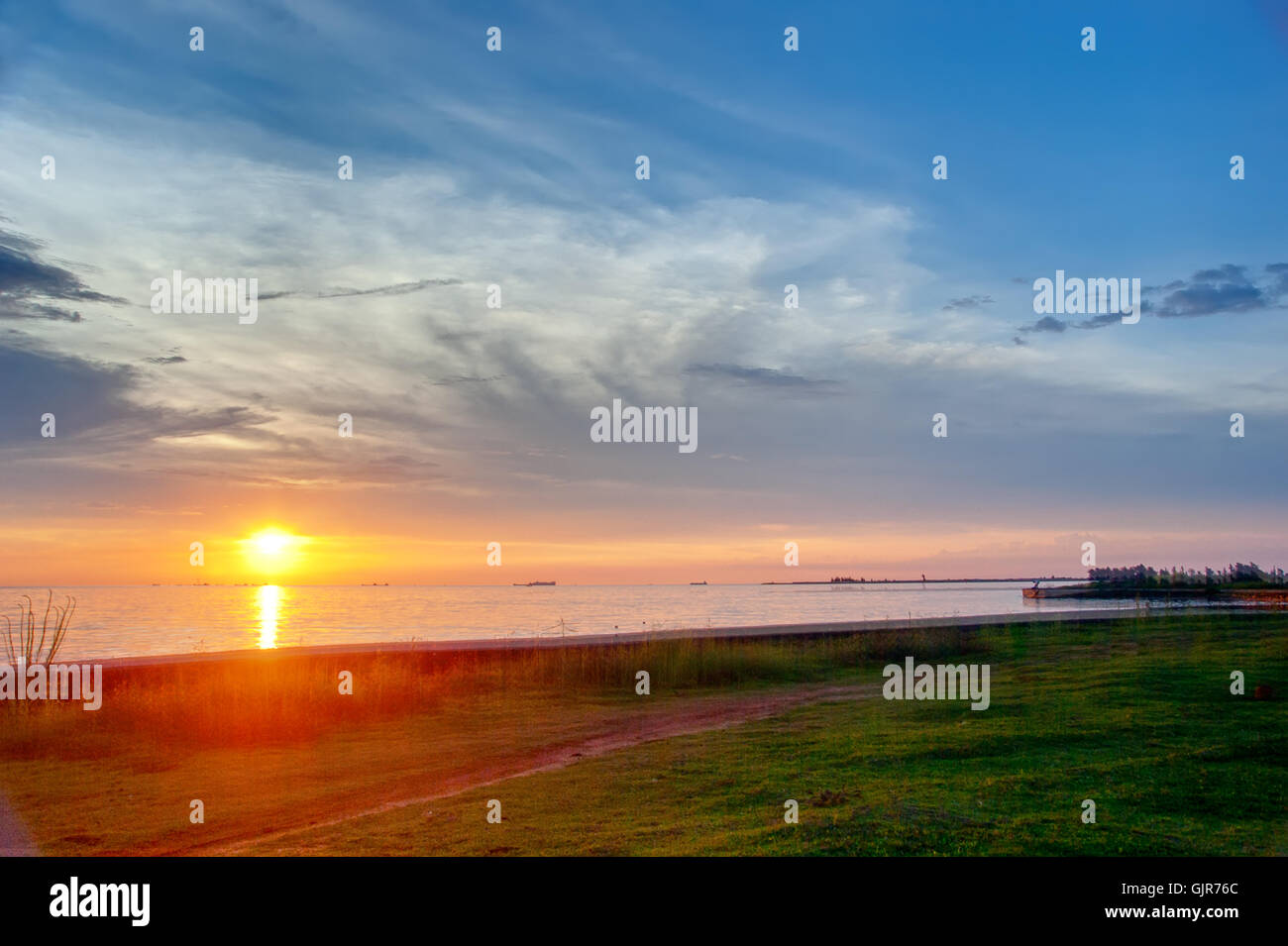 Sunset sea sky background material Stock Photo - Alamy