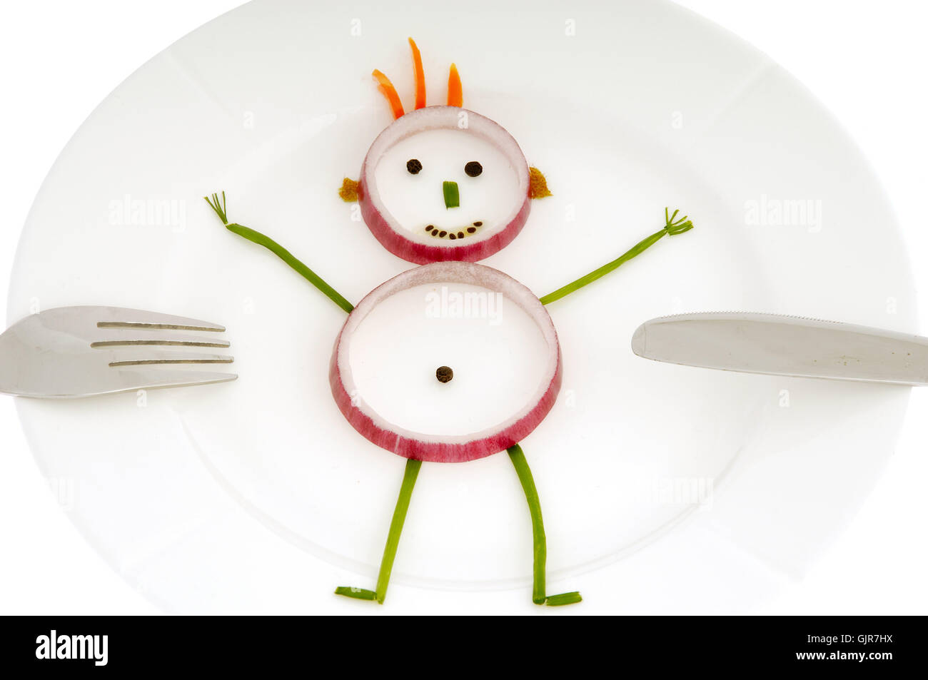 Vegetable man on dish Stock Photo - Alamy