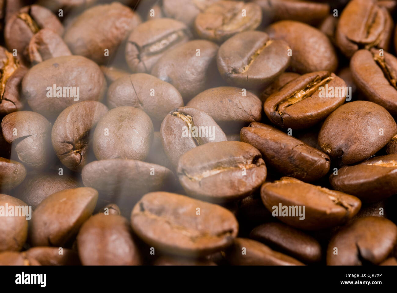 Baking coffee bean with smoke Stock Photo - Alamy