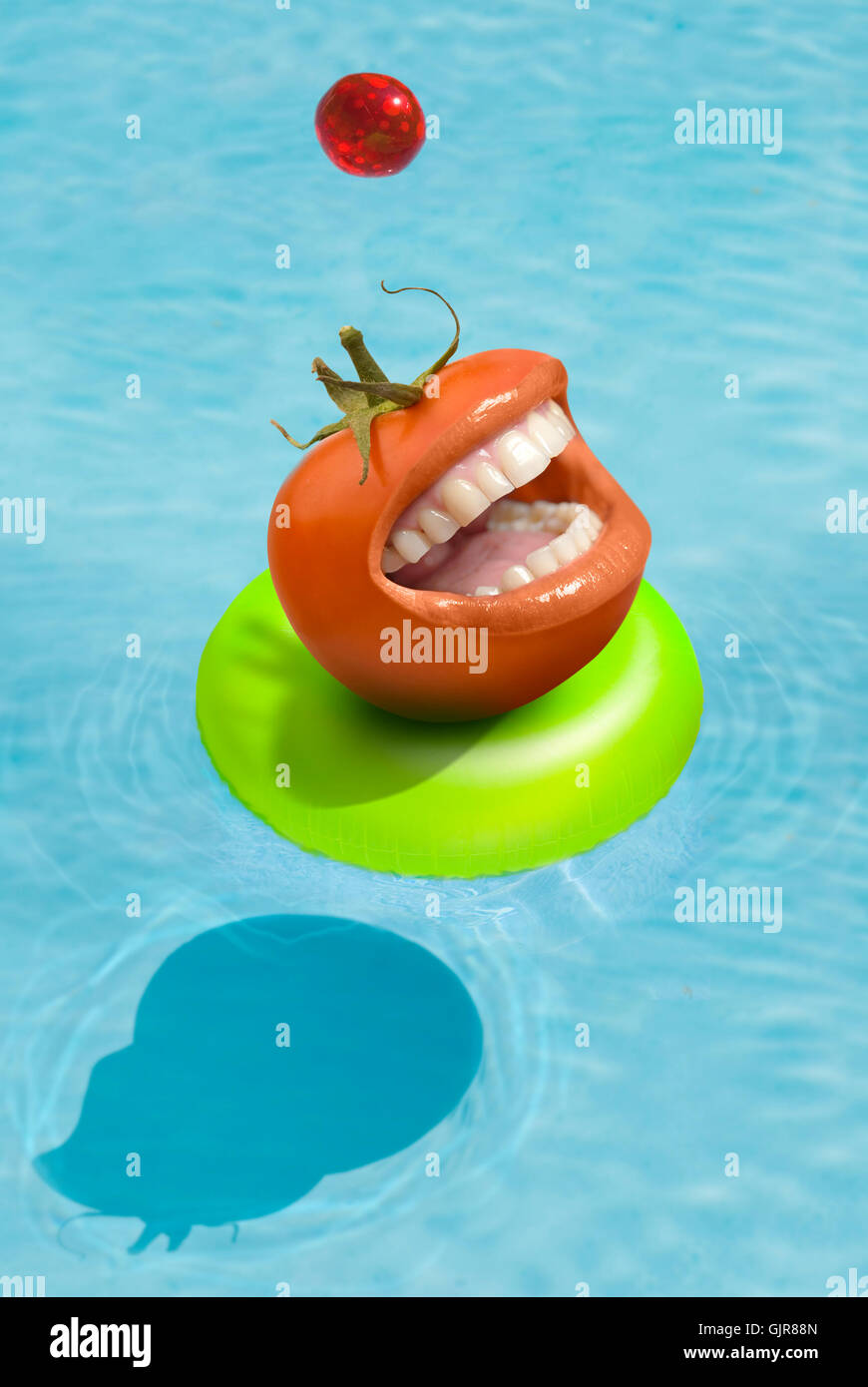 pool floating tomato Stock Photo - Alamy