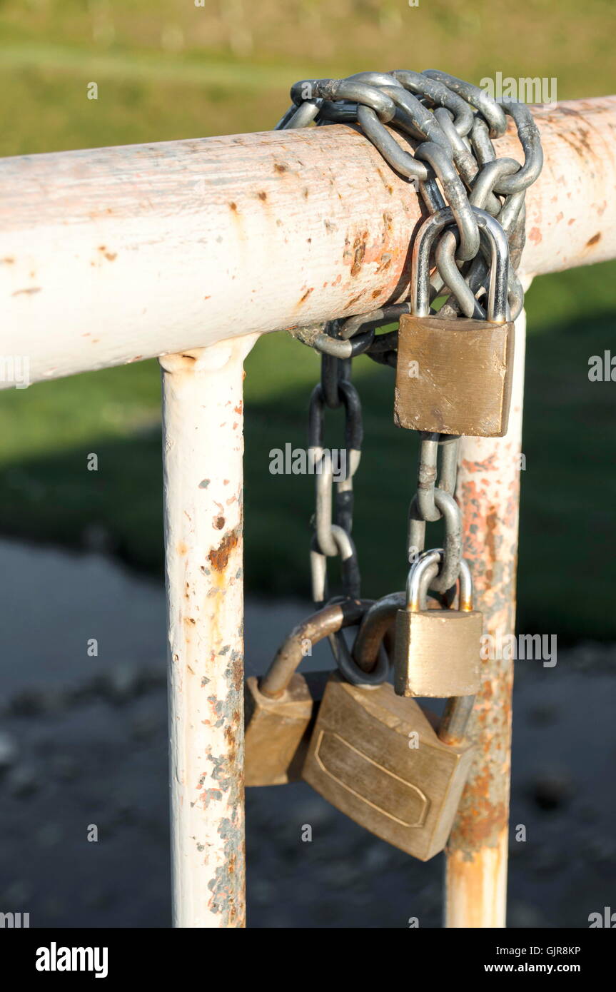 Lock on chain Stock Photo - Alamy