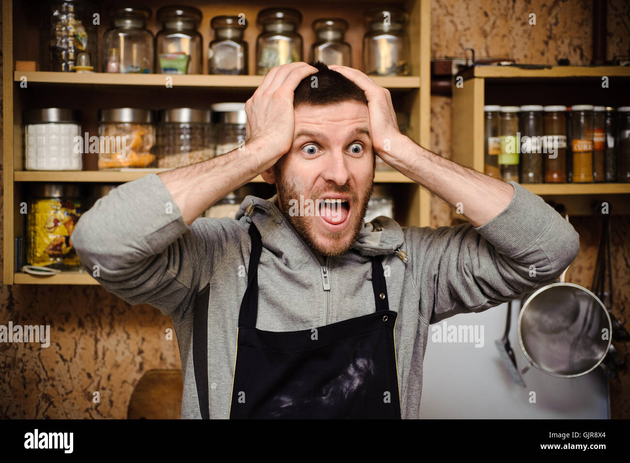 Helpless man in kitchen hi-res stock photography and images - Alamy