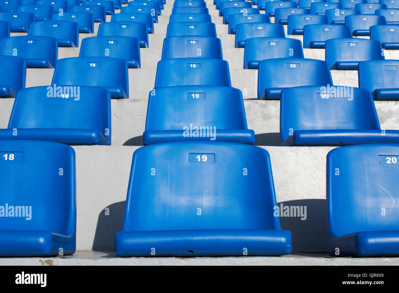 Blue stadium seats Stock Photo - Alamy