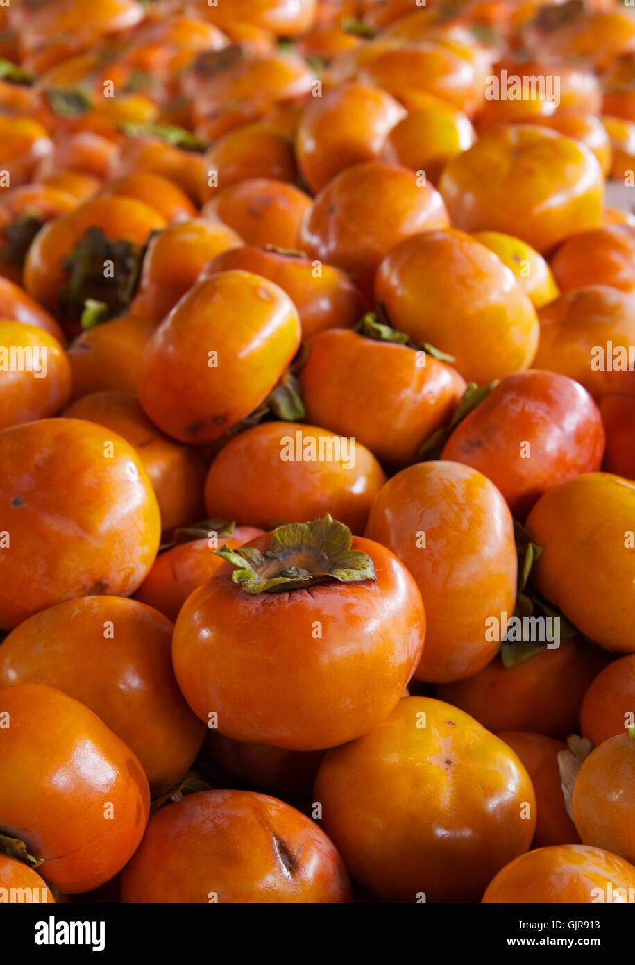 Pile of persimmons hi-res stock photography and images - Alamy