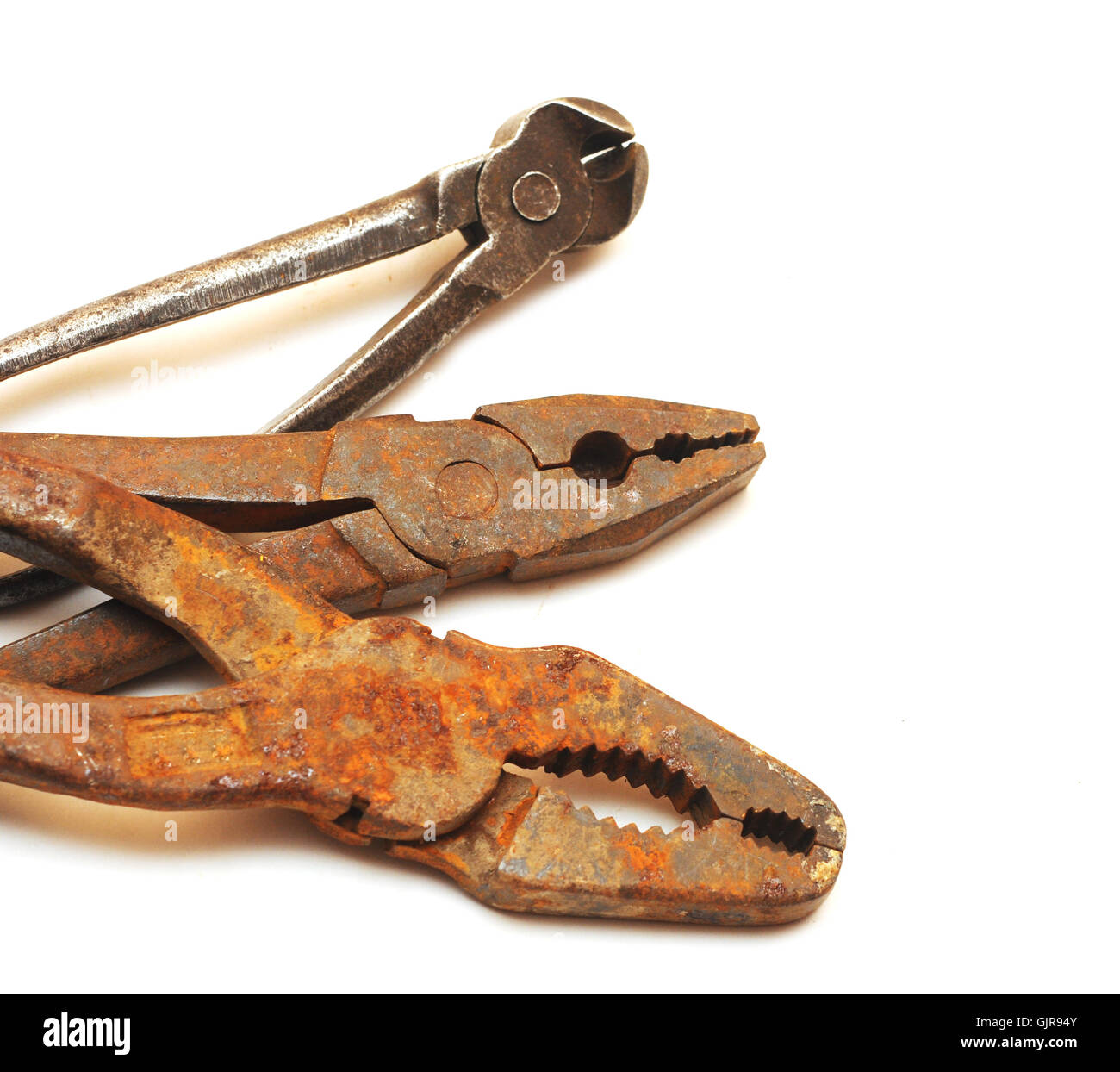 Old rusty pliers on a plain white background Stock Photo - Alamy