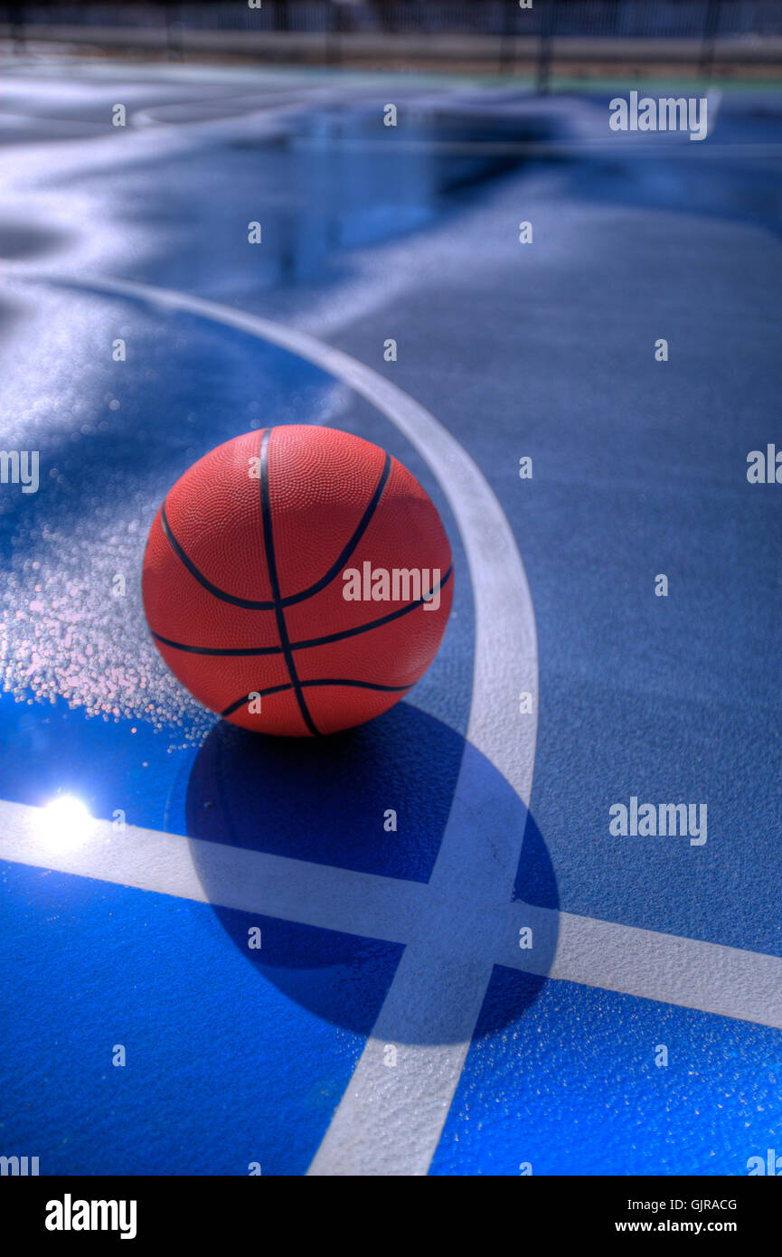 Basketball at midcourt Stock Photo - Alamy