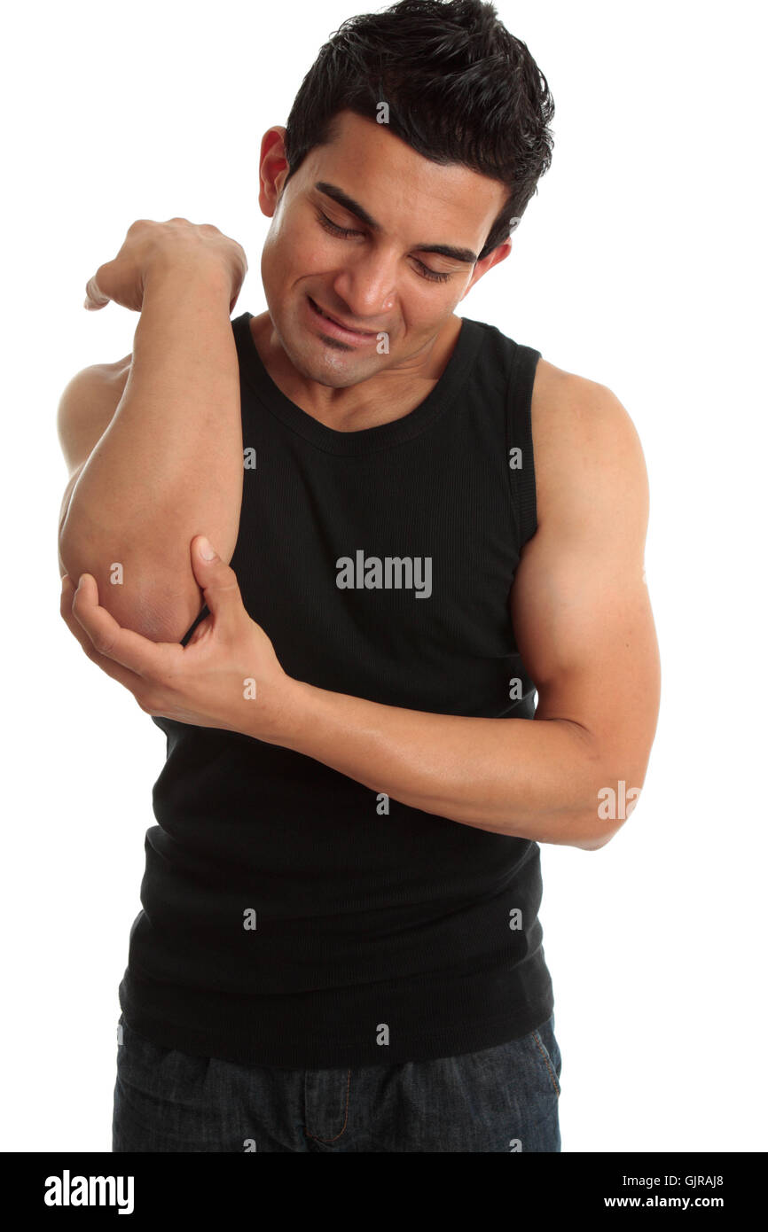 Man with injury wincing Stock Photo - Alamy