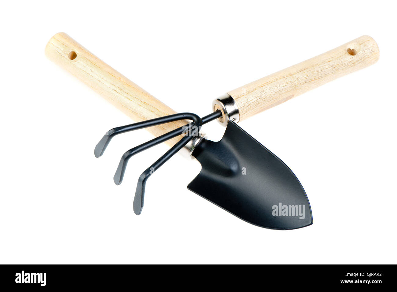 The garden tool a shovel, a rake Stock Photo - Alamy