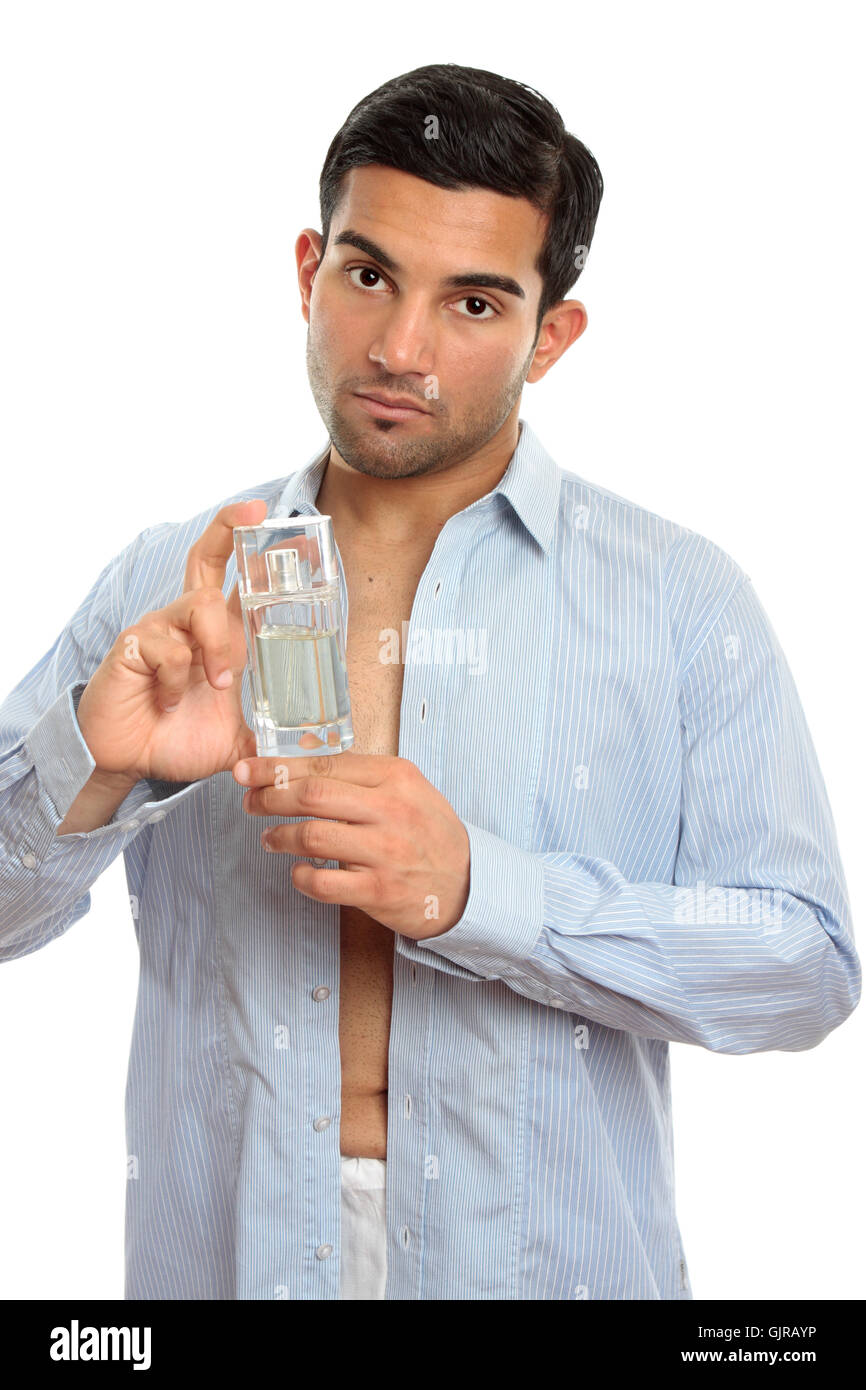 Man showing perfume cologne fragrance Stock Photo - Alamy