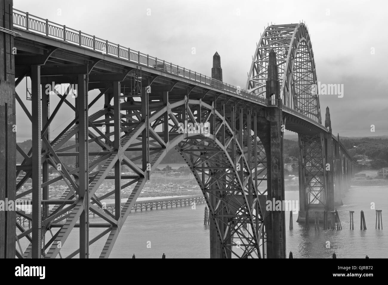 Misty bridge dark HDR ocean side black and white Stock Photo - Alamy