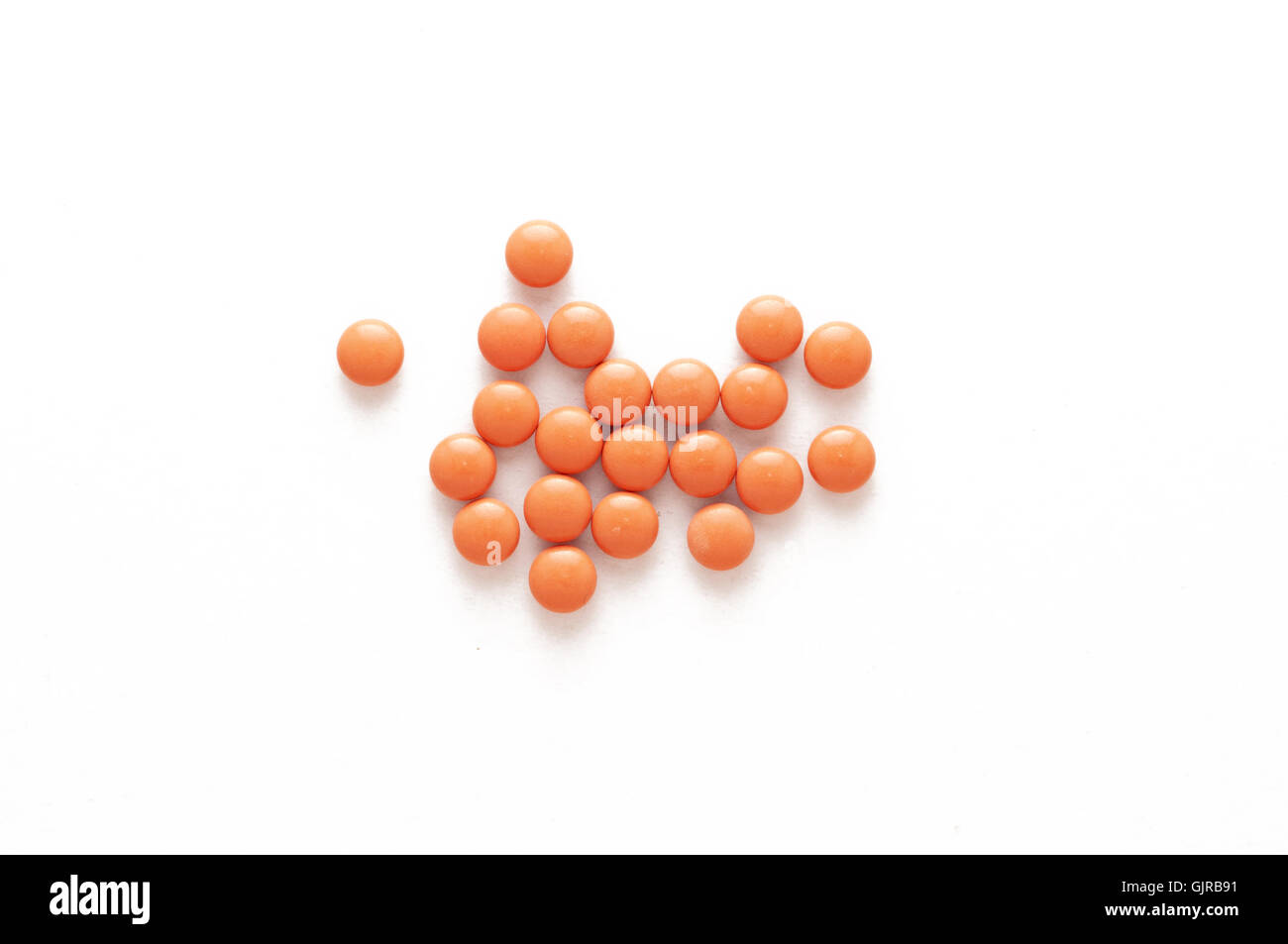 Orange Multi-Vitamin Pills Stock Photo - Alamy
