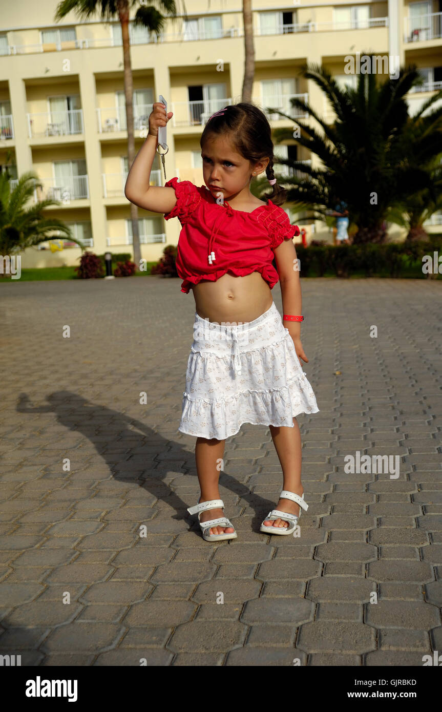 Young girl holding key Stock Photo - Alamy