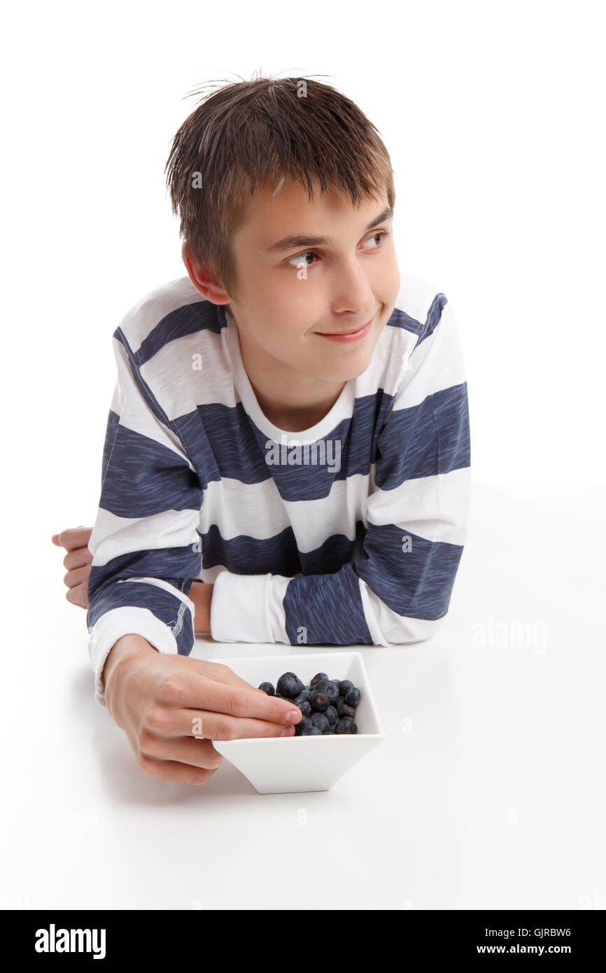 Boy eating blueberries Stock Photo - Alamy