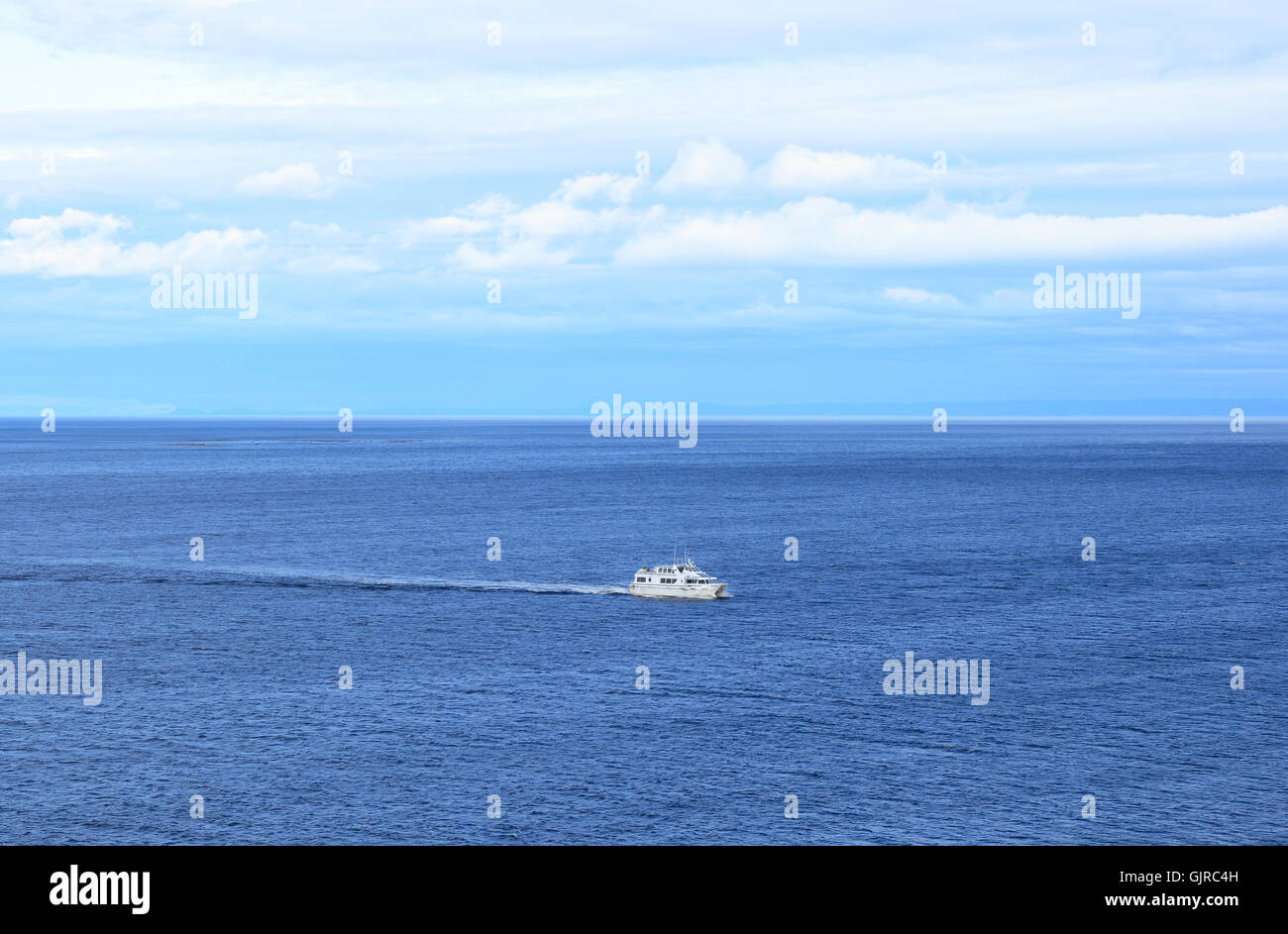 Ship in the calm blue sea Stock Photo - Alamy