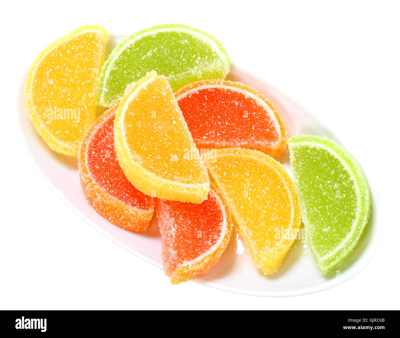 Group of sweets as citrus fruits on white plate Stock Photo - Alamy