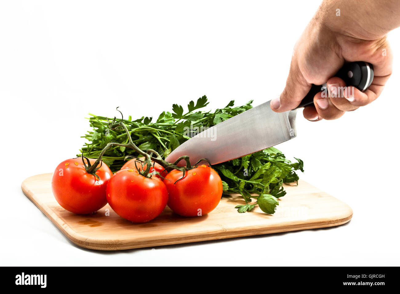 Tomato with parsely Stock Photo - Alamy