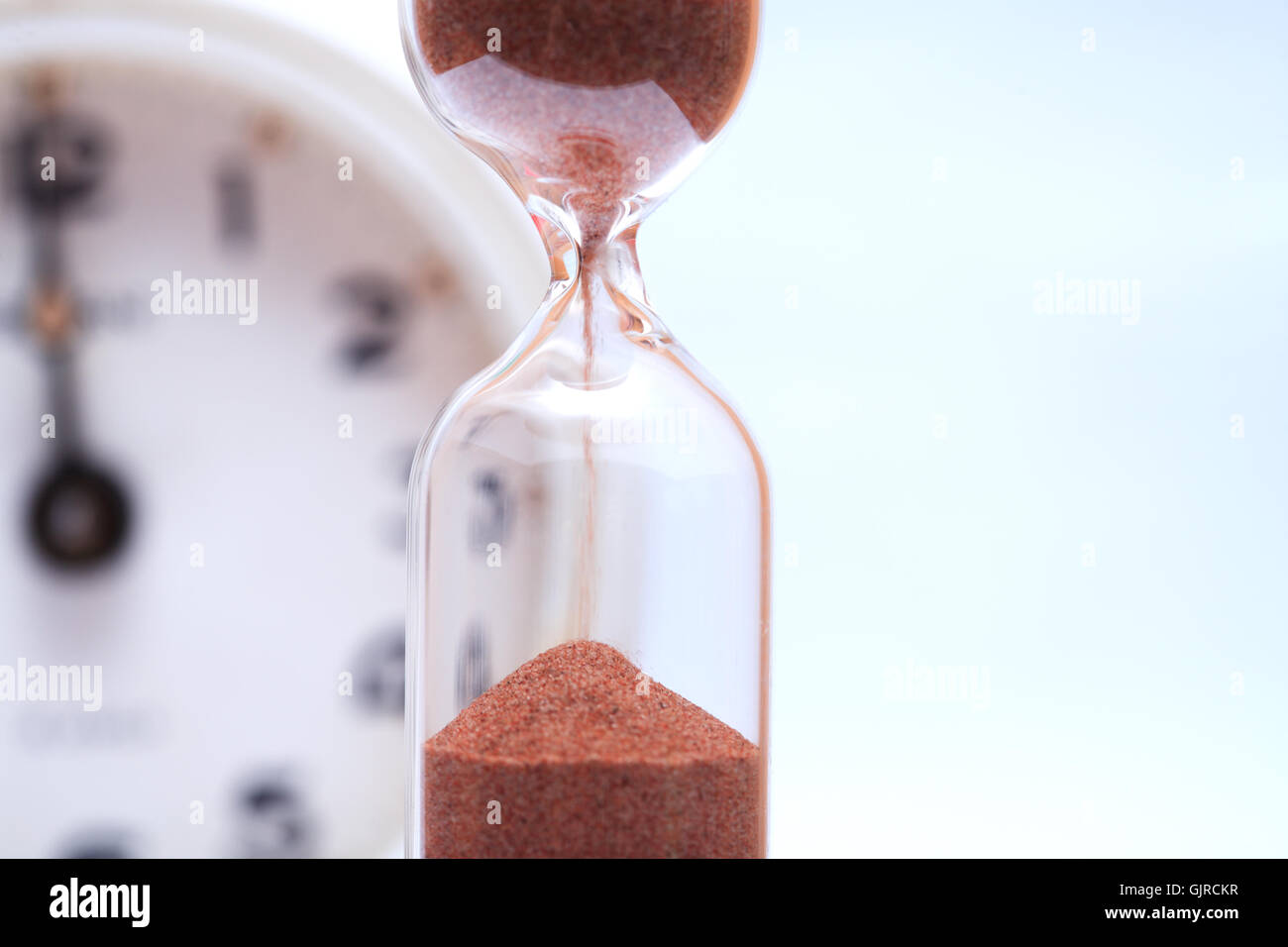 Hourglass And Clock Stock Photo - Alamy