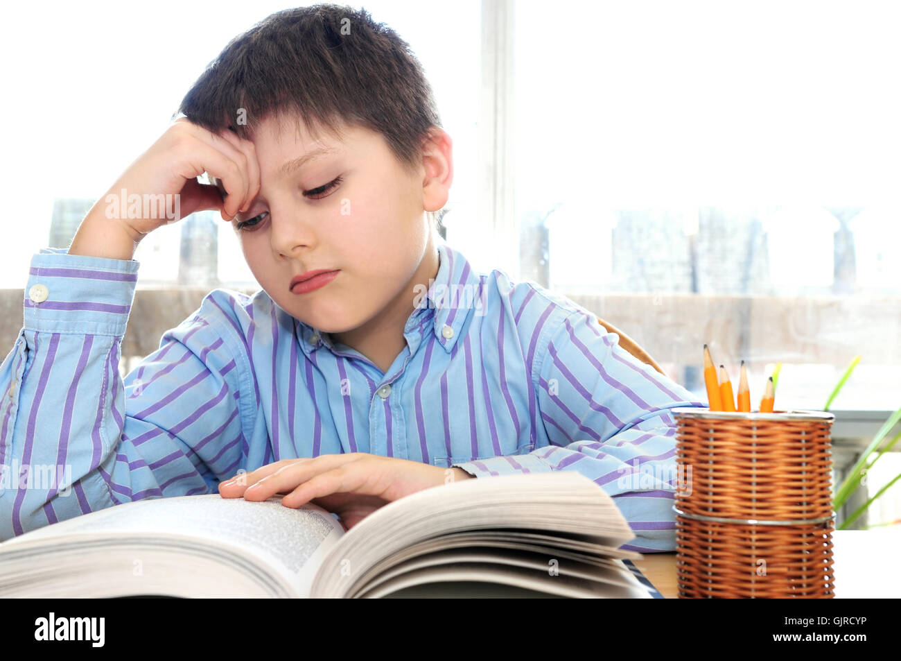 sad student reading Stock Photo - Alamy