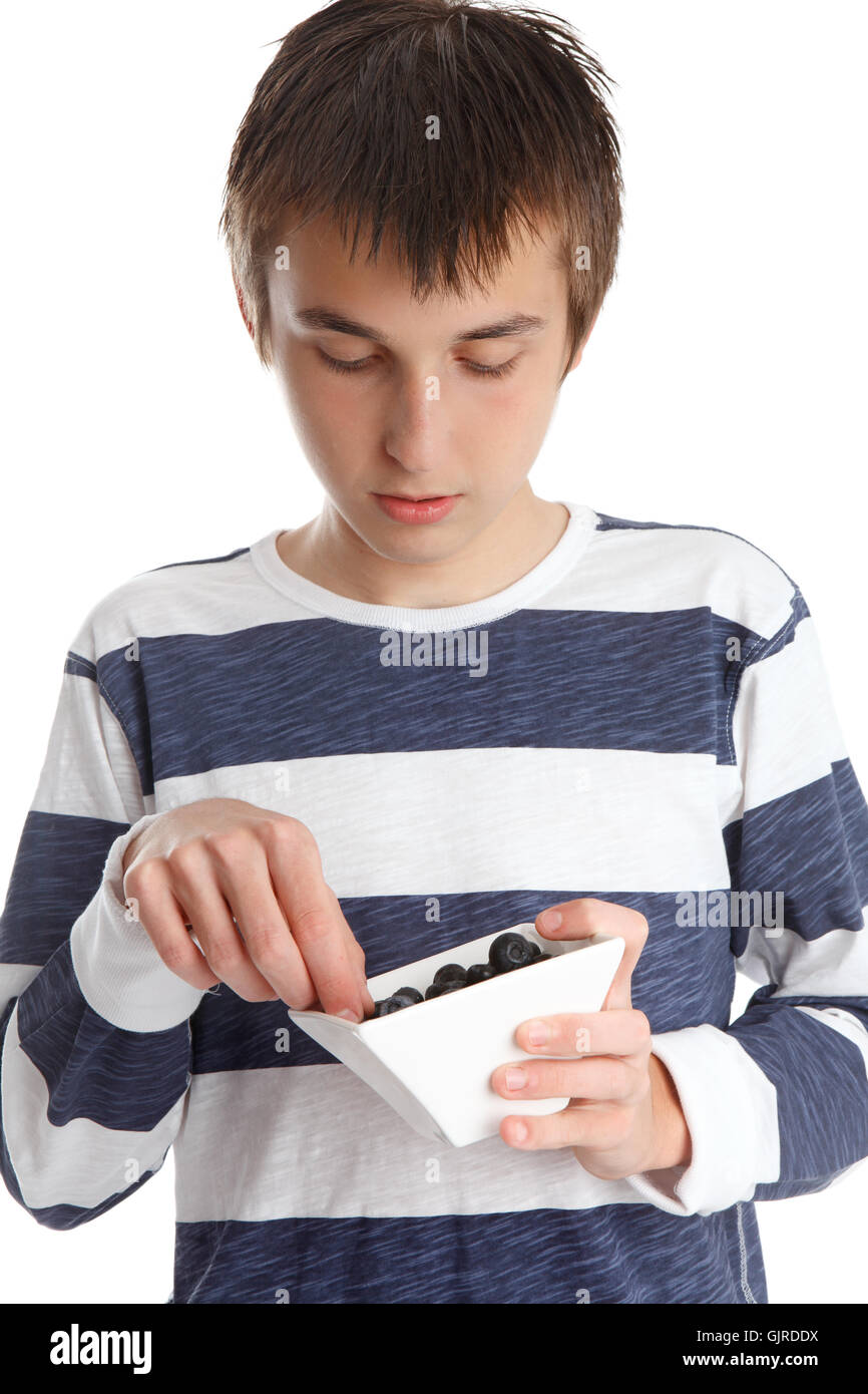 Child eating blueberries Stock Photo - Alamy