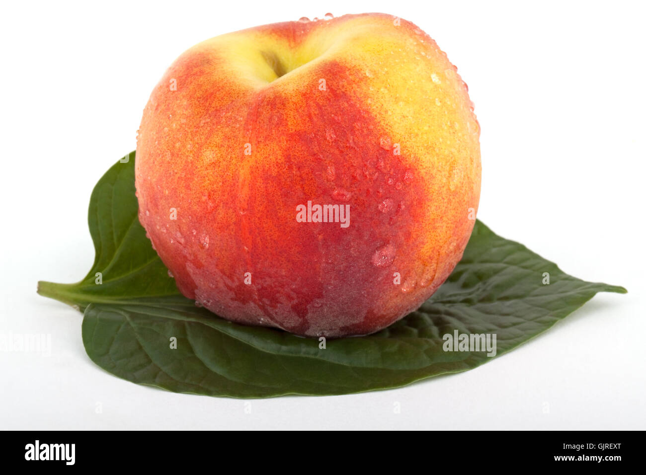 peach with leaf Stock Photo - Alamy