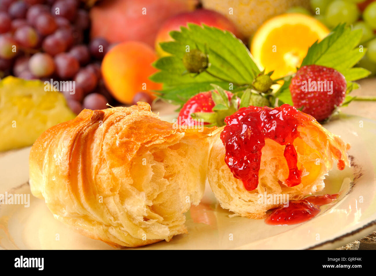 croissant with strawberry jam Stock Photo - Alamy