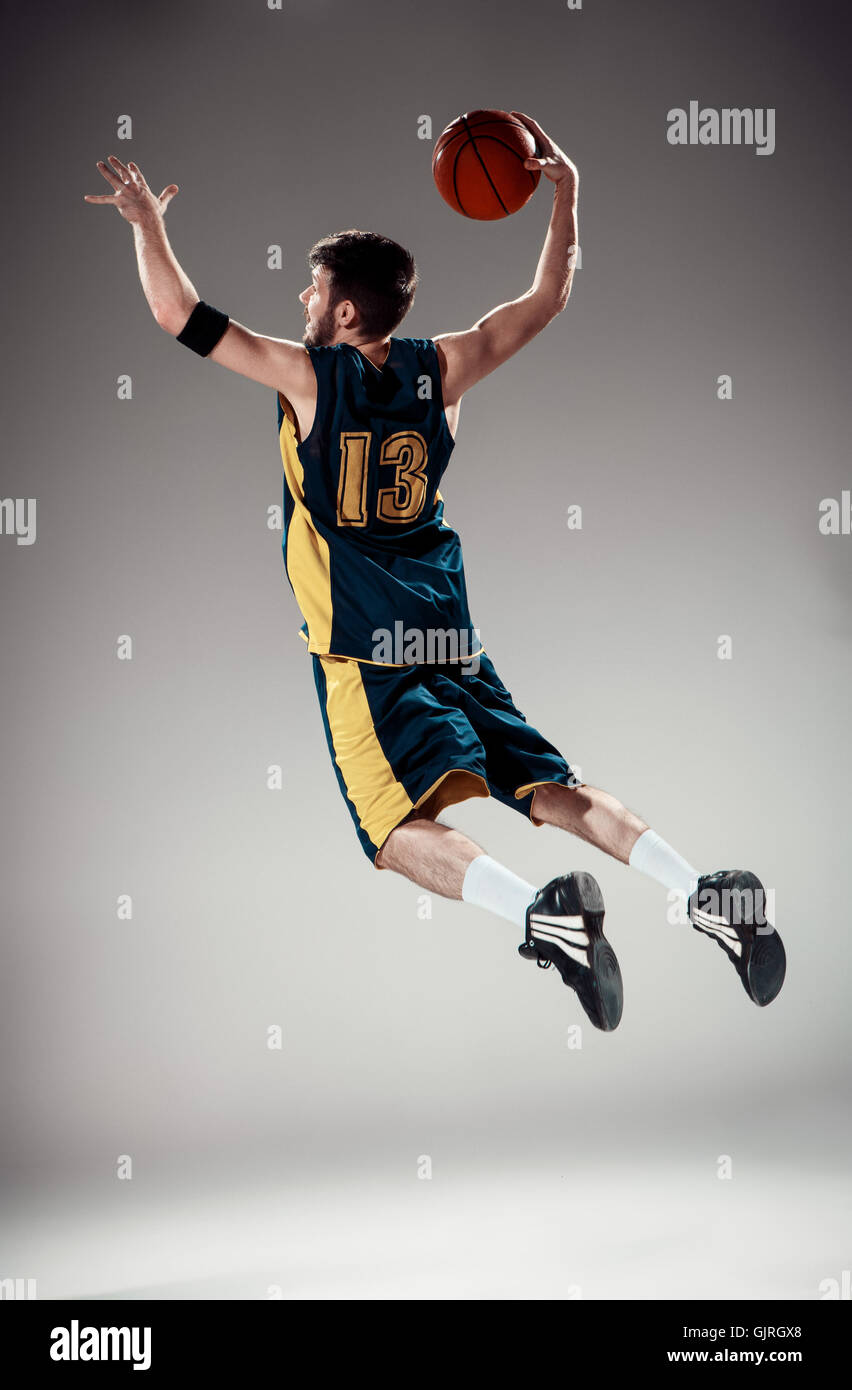 Full length portrait of a basketball player with ball Stock Photo - Alamy
