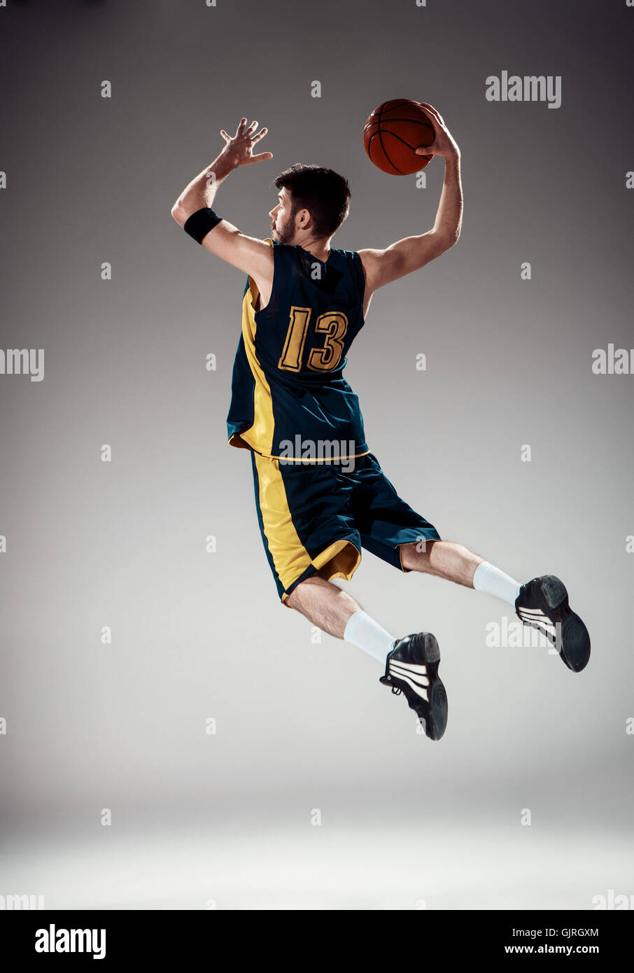 Full length portrait of a basketball player with ball Stock Photo - Alamy