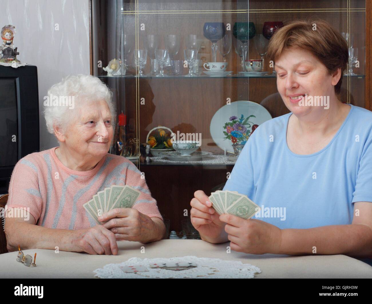 play at cards grandma Stock Photo - Alamy