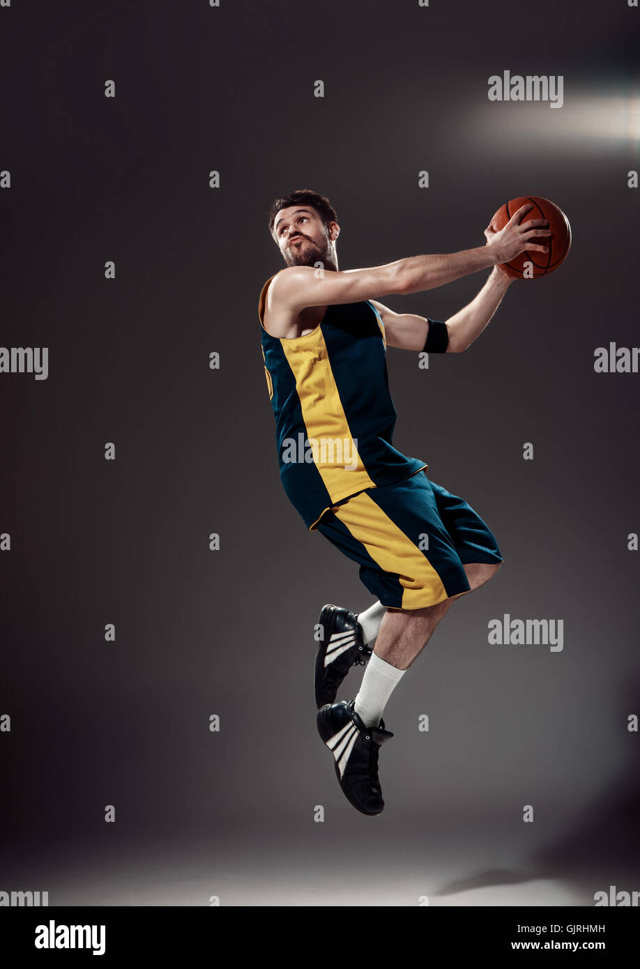 Full length portrait of a basketball player with ball Stock Photo - Alamy