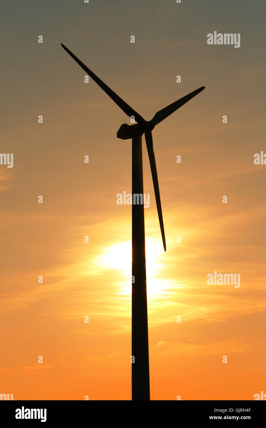 generation of electricity sunset wind power station Stock Photo - Alamy