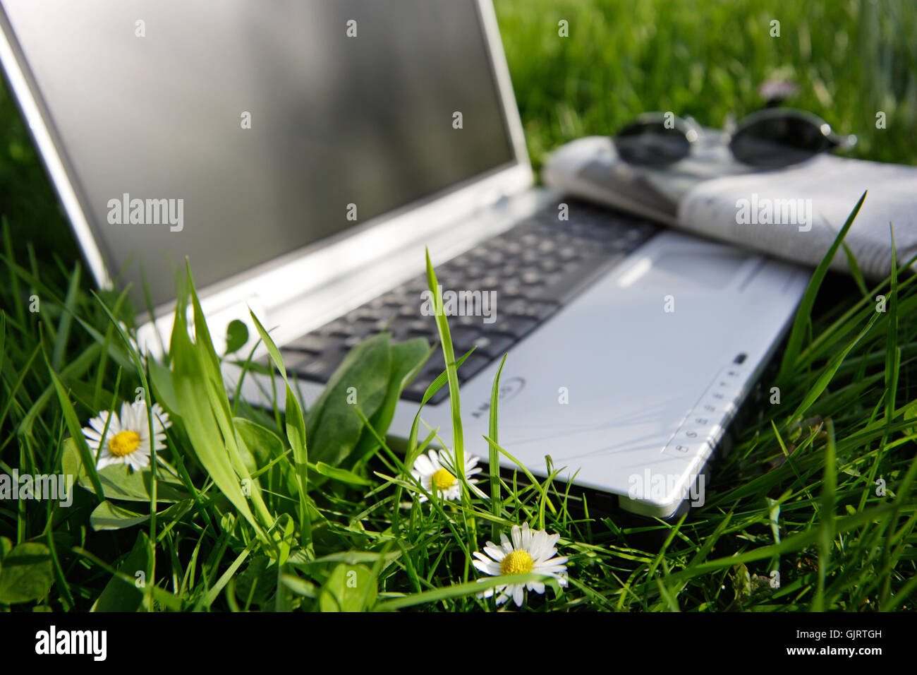 newspaper journal laptop Stock Photo - Alamy