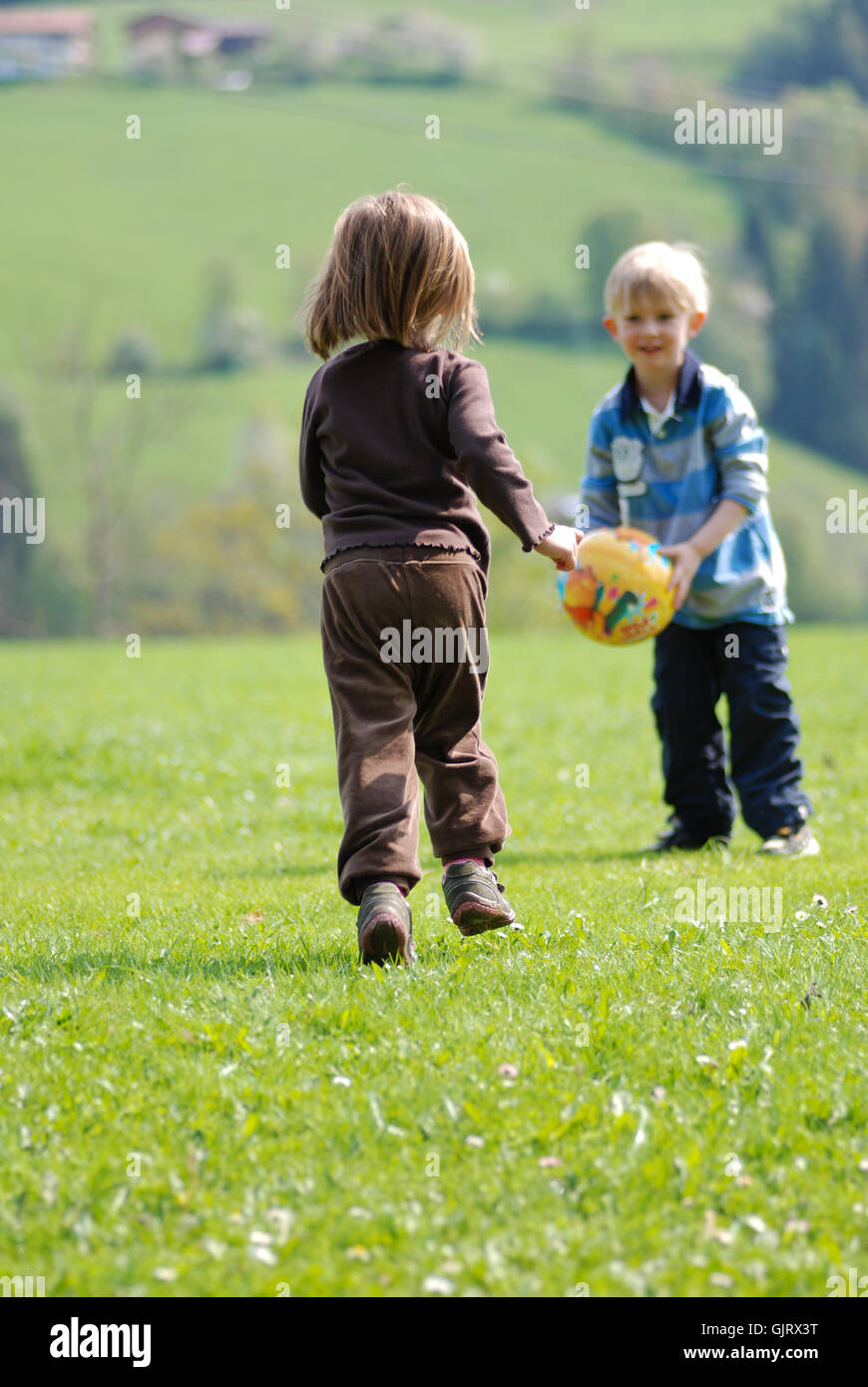 Kindergarten children play football soccer hi-res stock photography and ...