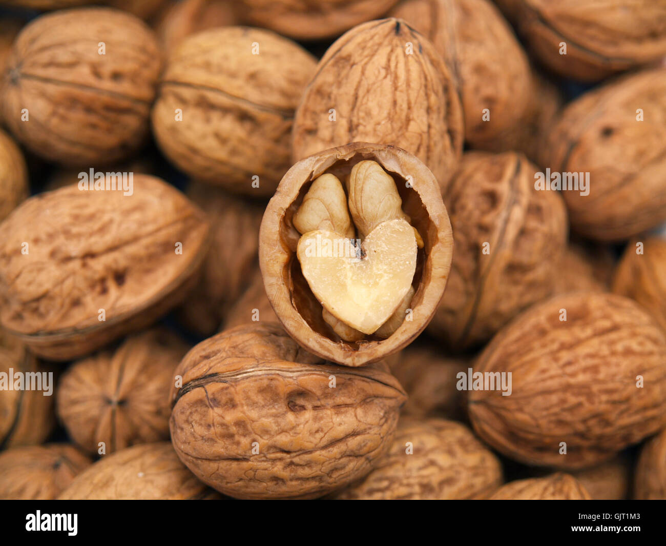 walnut in heart shape Stock Photo - Alamy