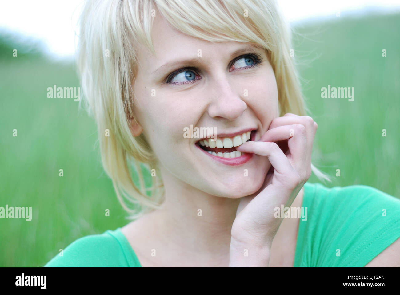 Woman chewing fingernails hi-res stock photography and images - Alamy