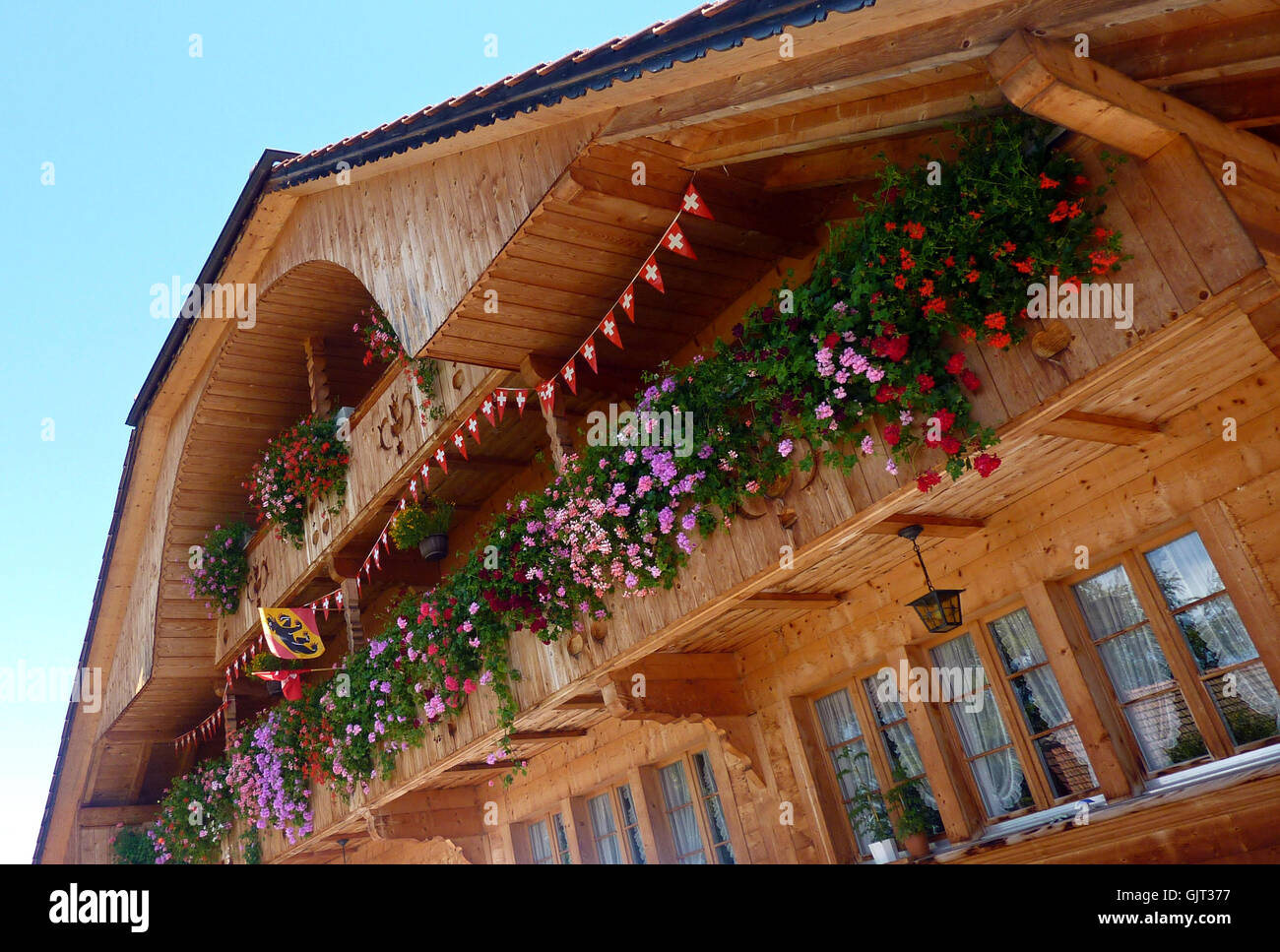 Farmhouse with geraniums hi-res stock photography and images - Alamy