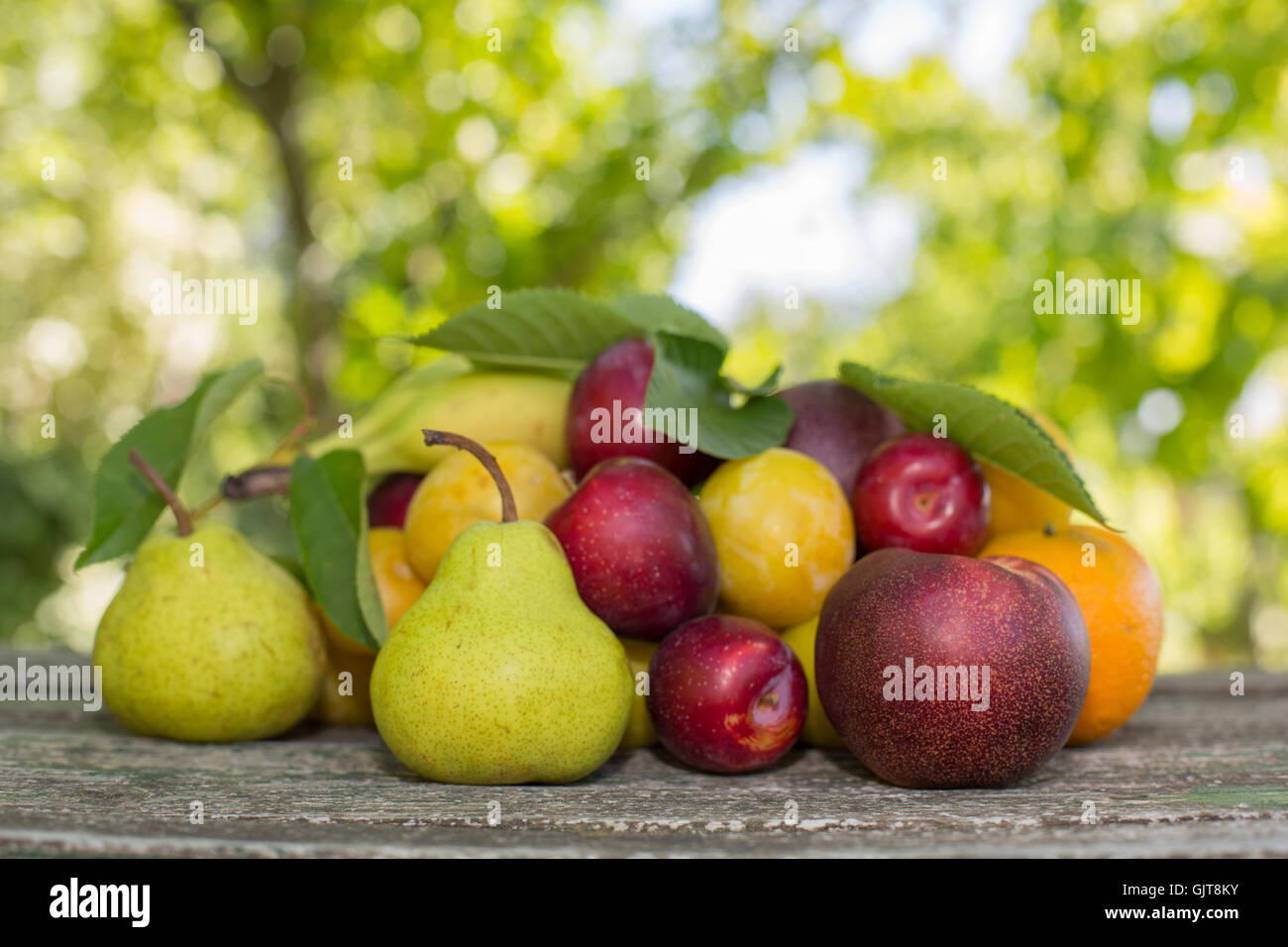 fruits in wooden table, outdoor Stock Photo - Alamy