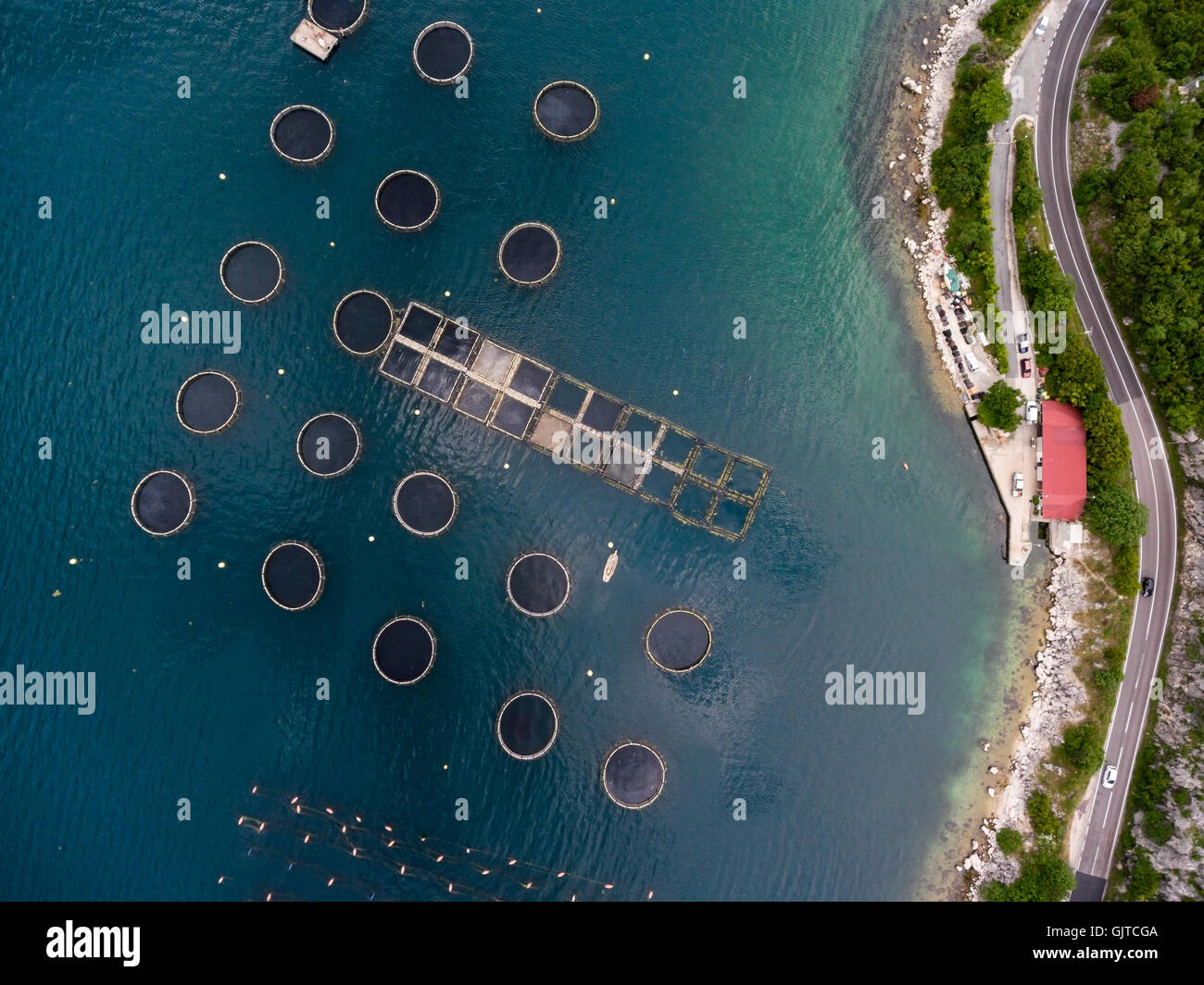 Structure of fish farm, aerial view. Boat for fish feeding. Aquaculture ...