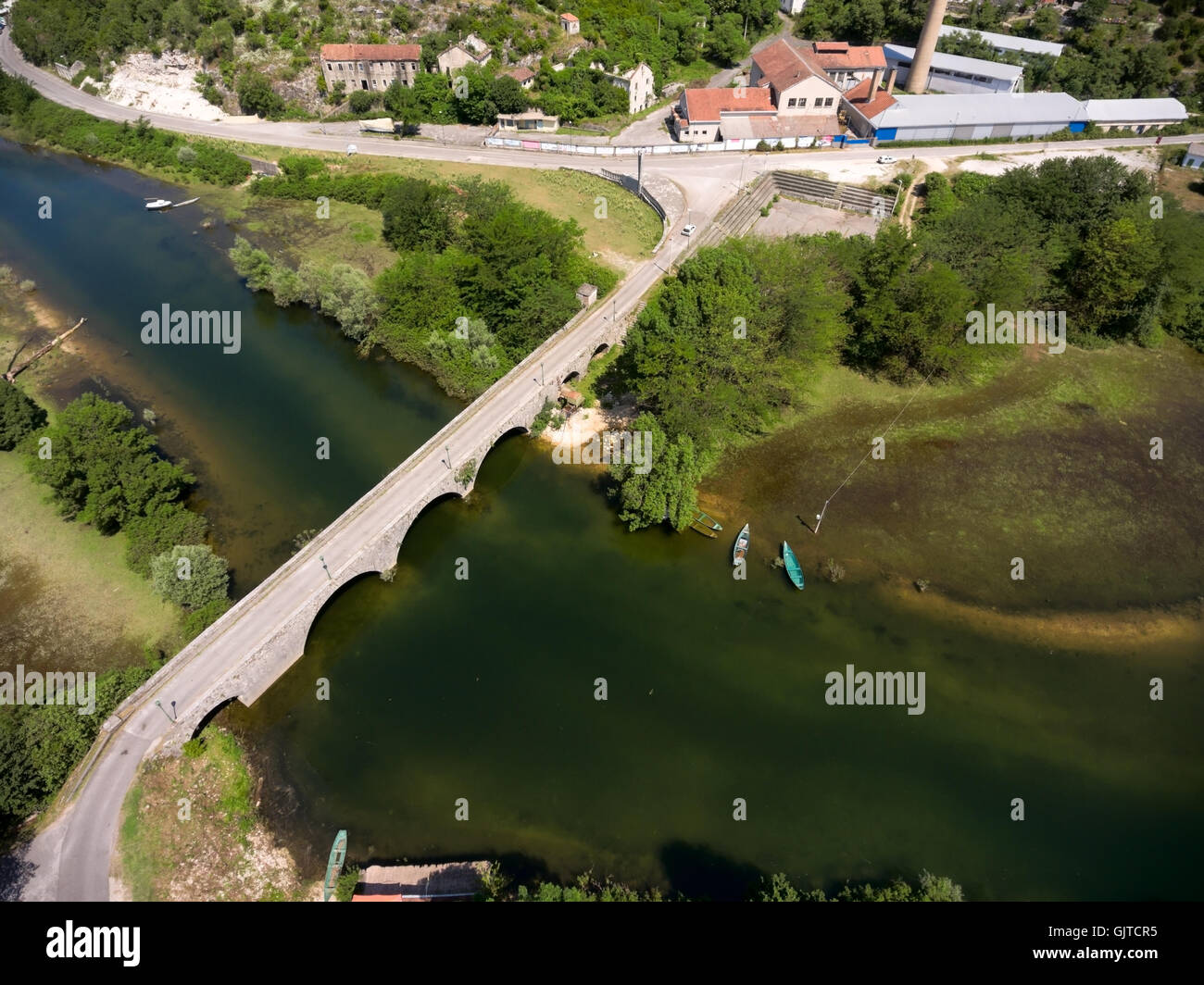 Transportation arch bridge across river Crnojevica in Rjieka Crnojevica ...