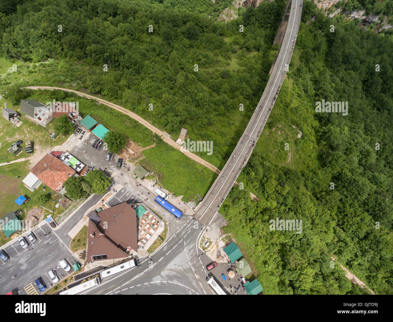 Bus parking, hotels and souvenir shops are on crossing of road. Tara ...