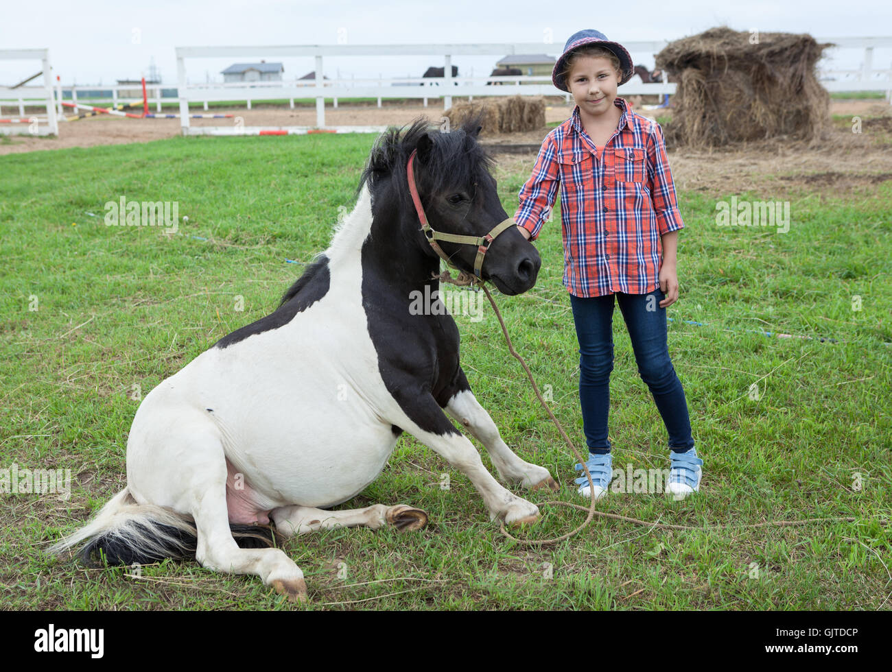 Child sitting on one horse hi-res stock photography and images - Alamy