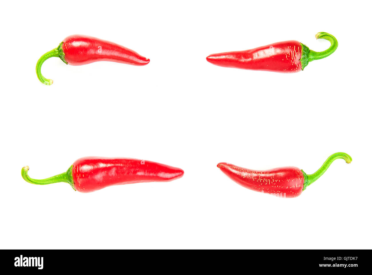 Four ripe red Chilli peppers on over white Stock Photo - Alamy