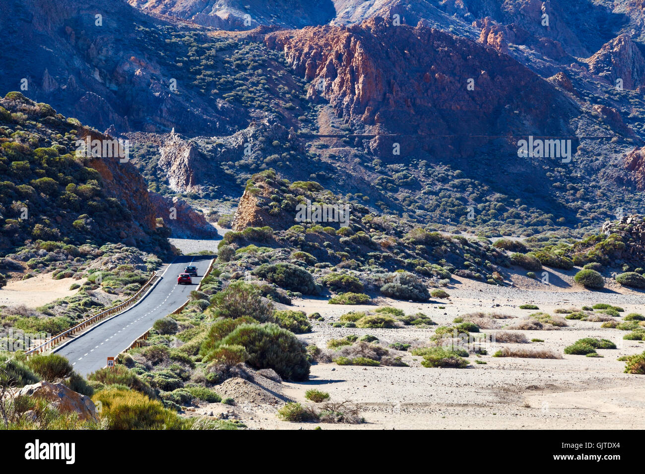 Cars driving on the highway TF-21, leading from the Teide volcano to ...