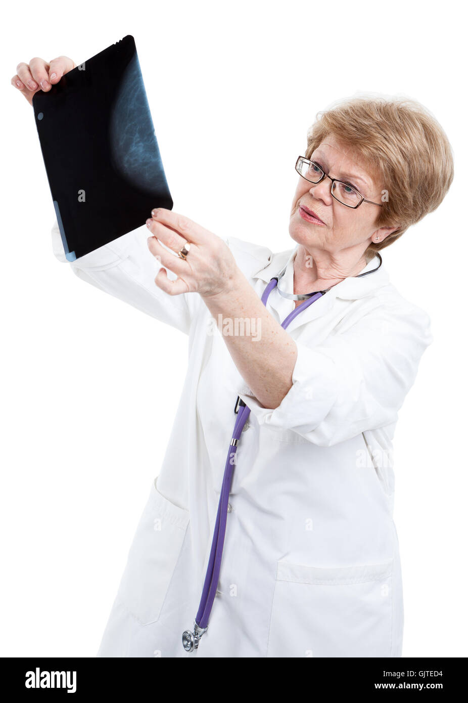 Elderly doctor radiologist examines x-ray image, isolated on white ...
