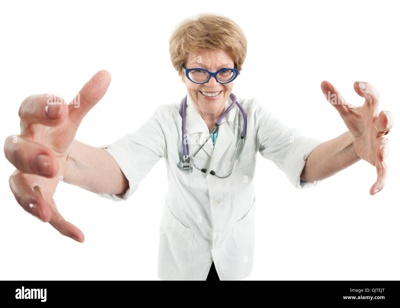Mad senior female doctor stretching hands to camera with smile ...