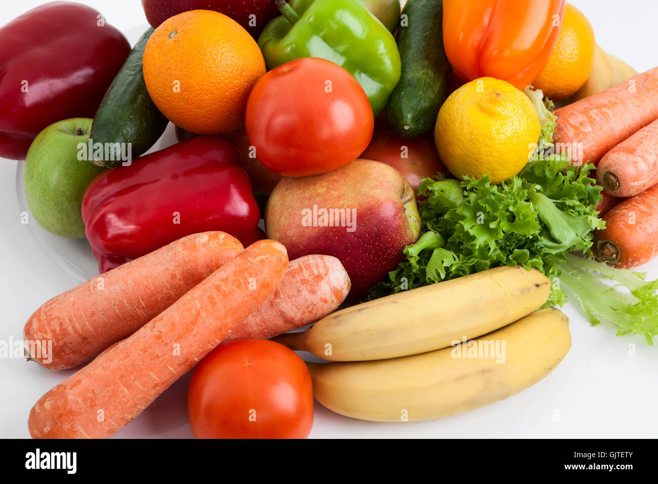 Ripe and fresh fruits and vegetables laying on the table Stock Photo ...